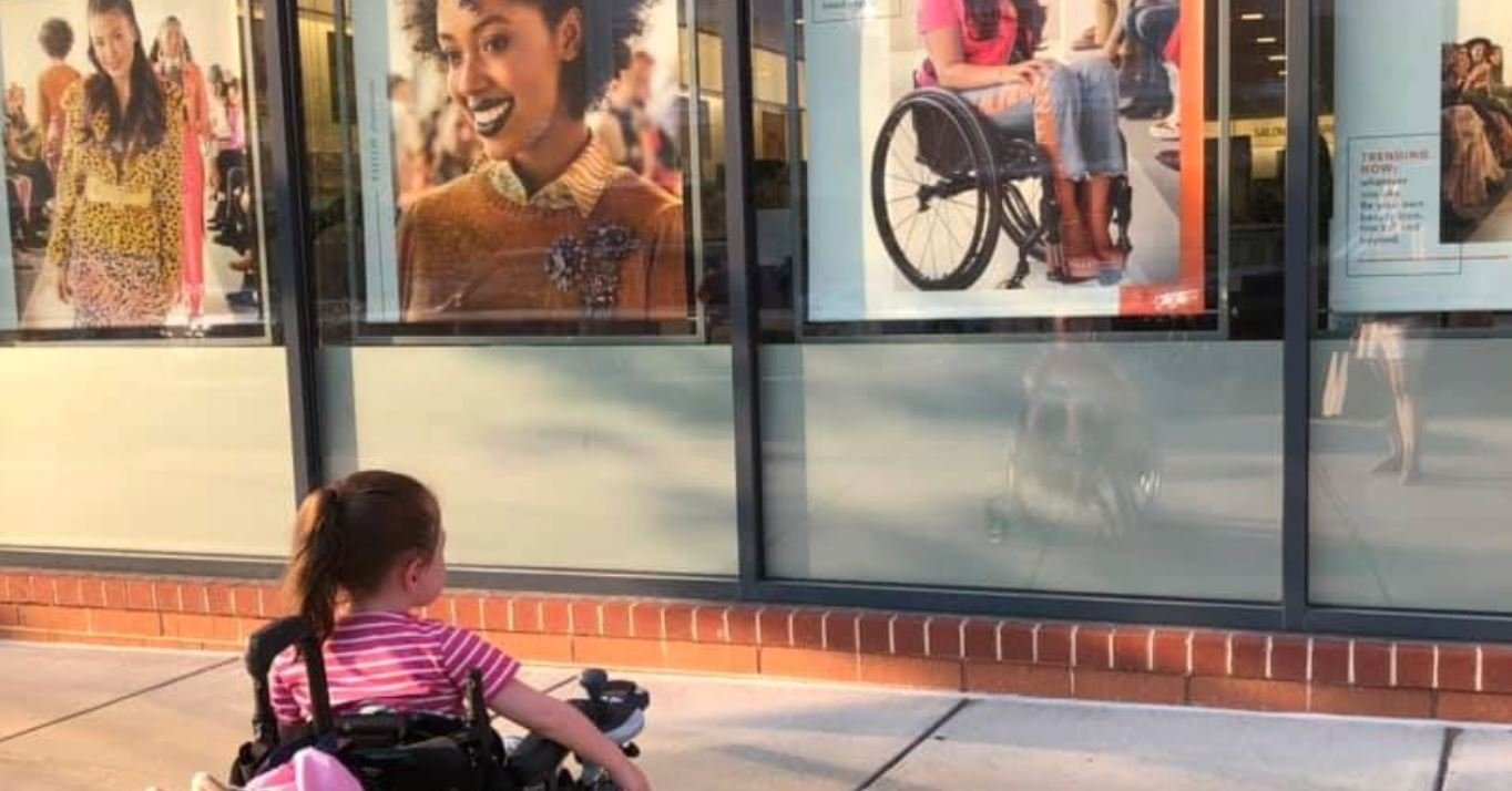 Inclusive Store Window Ad Featuring A Woman In A Wheelchair Stops ...